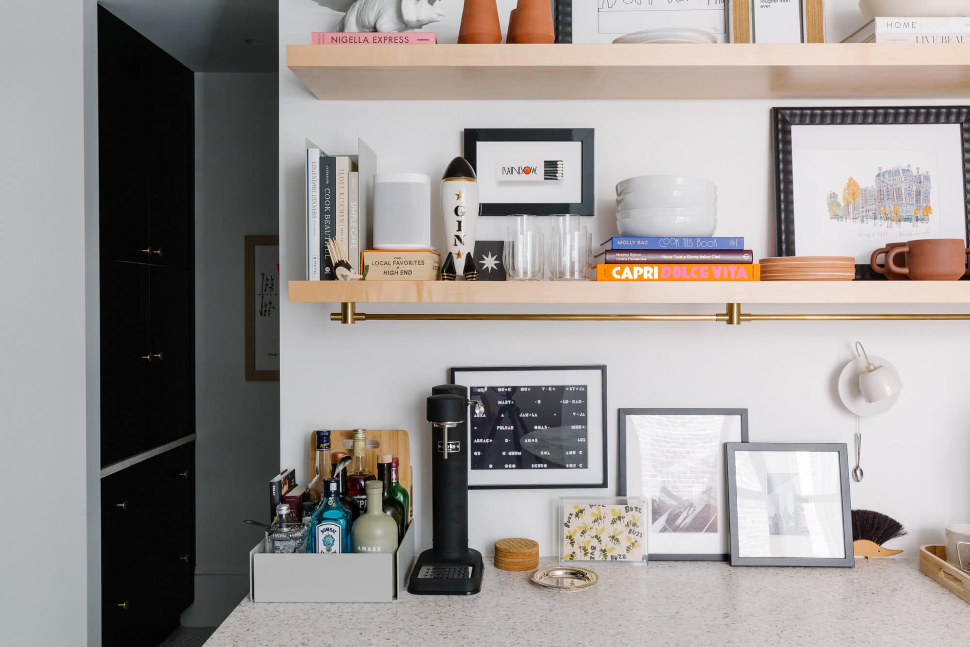 This Tiny NYC Kitchen Includes Black Cabinetry and Tons of Storage